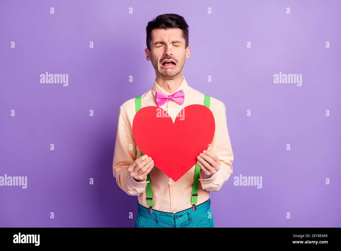 Photo of upset crying young man dressed yellow feeling lonely holding ...