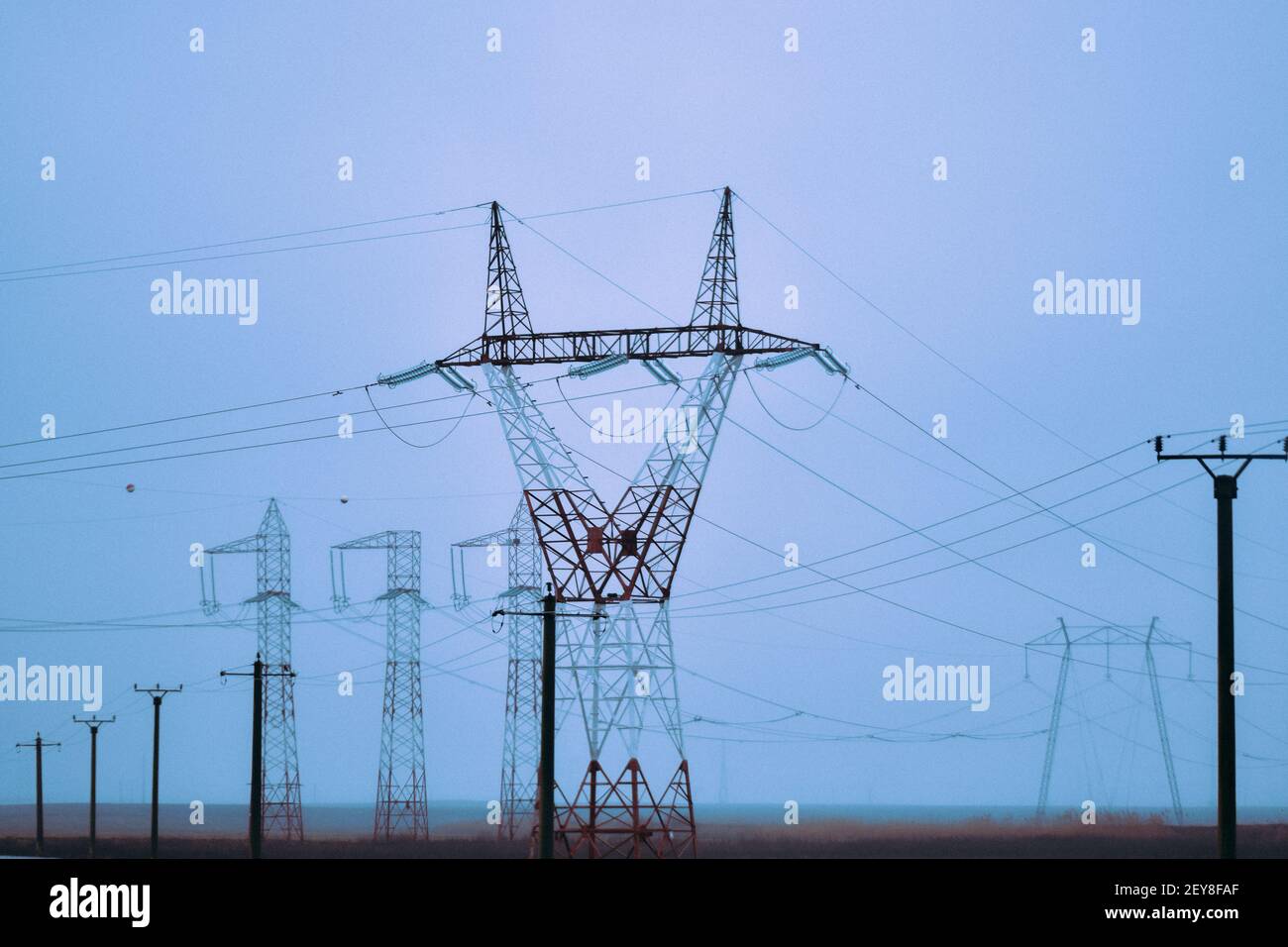 A landscape with a lot of power transmission towers Stock Photo - Alamy