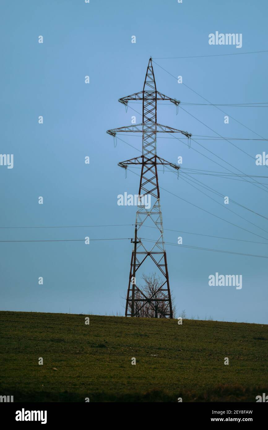 A landscape with a power transmission tower Stock Photo - Alamy