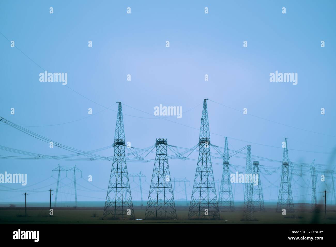 A landscape with a lot of power transmission towers Stock Photo - Alamy