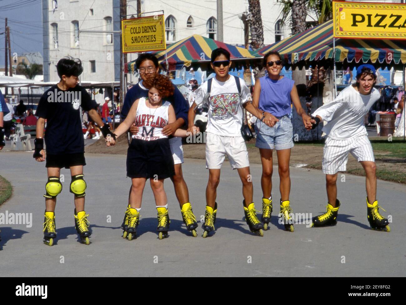 Young people trying out rollerblading for the first time in Venice ...