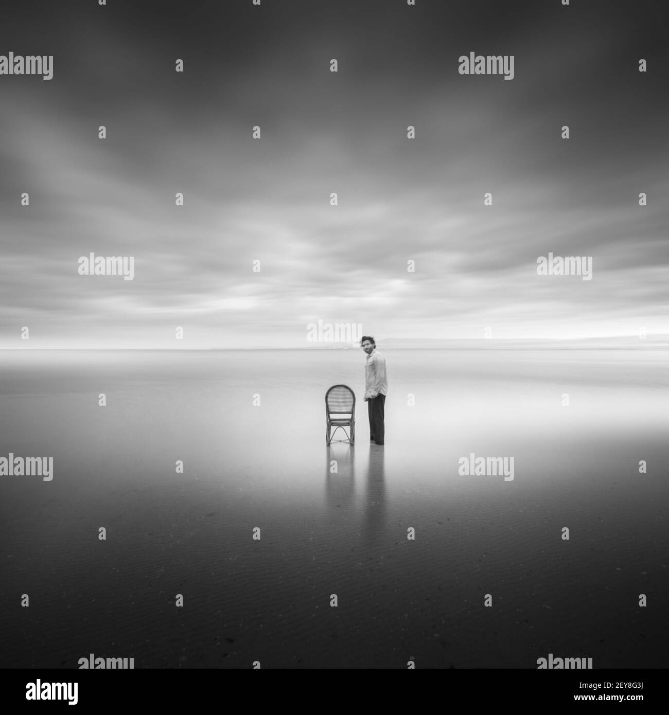 A greyscale shot of a male in front of a Stock Photo - Alamy