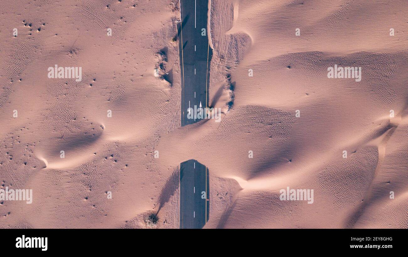 A highway covered by sand after a sandstorm in a desert in UAE Stock ...