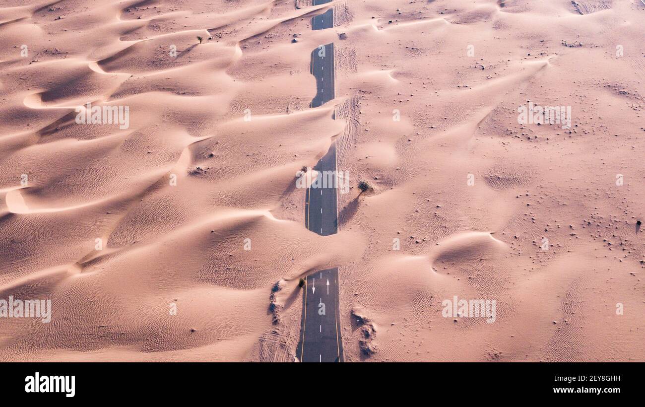 A highway covered by sand after a sandstorm in a desert in UAE Stock ...