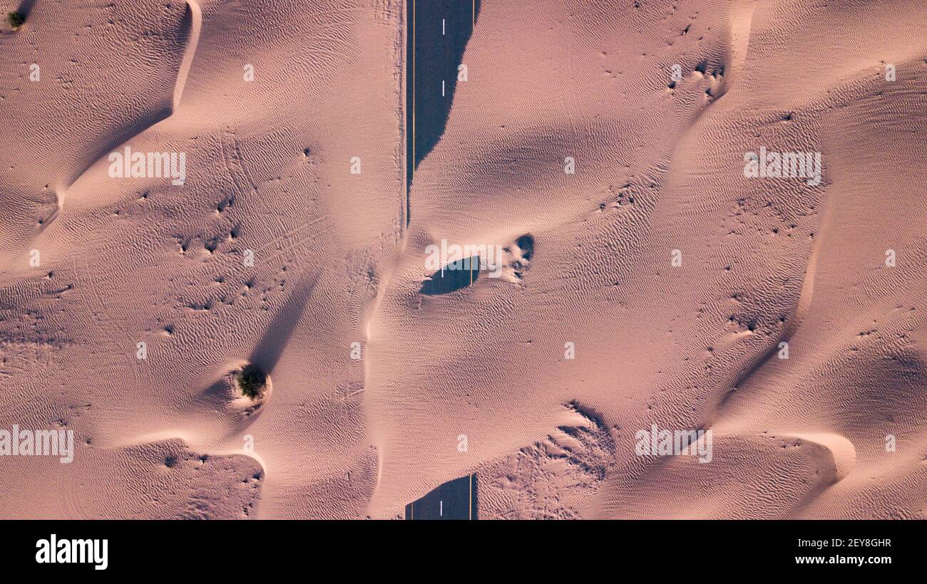A highway covered by sand after a sandstorm in a desert in UAE Stock ...