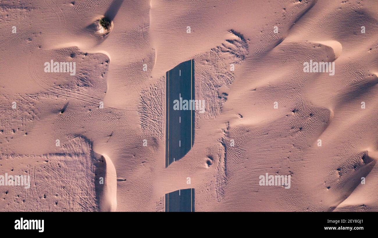 A highway covered by sand after a sandstorm in a desert in UAE Stock ...