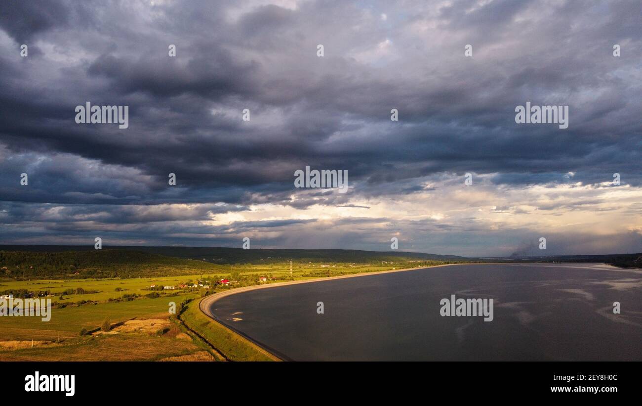 A mesmerizing view of a landscape with a flowing river gleaming under ...