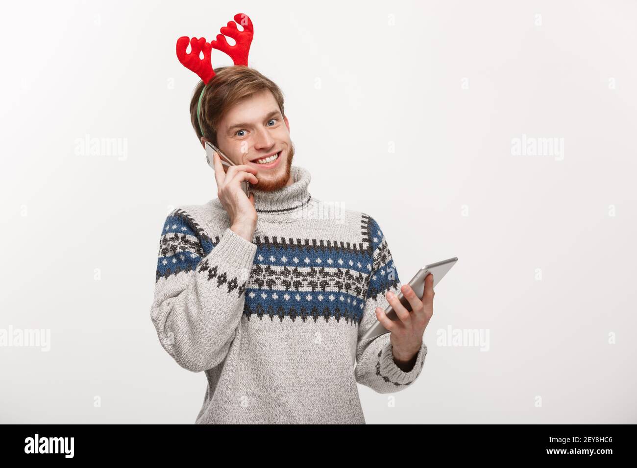 Holiday and Business Concept - Young handsome man busy working on phone ...