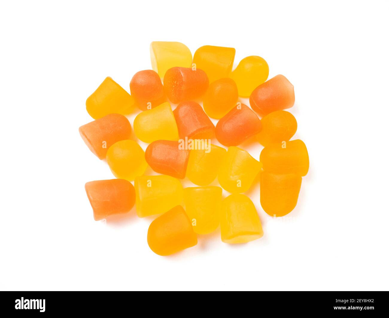Close-up texture of orange and yellow multivitamin gummies. Healthy ...