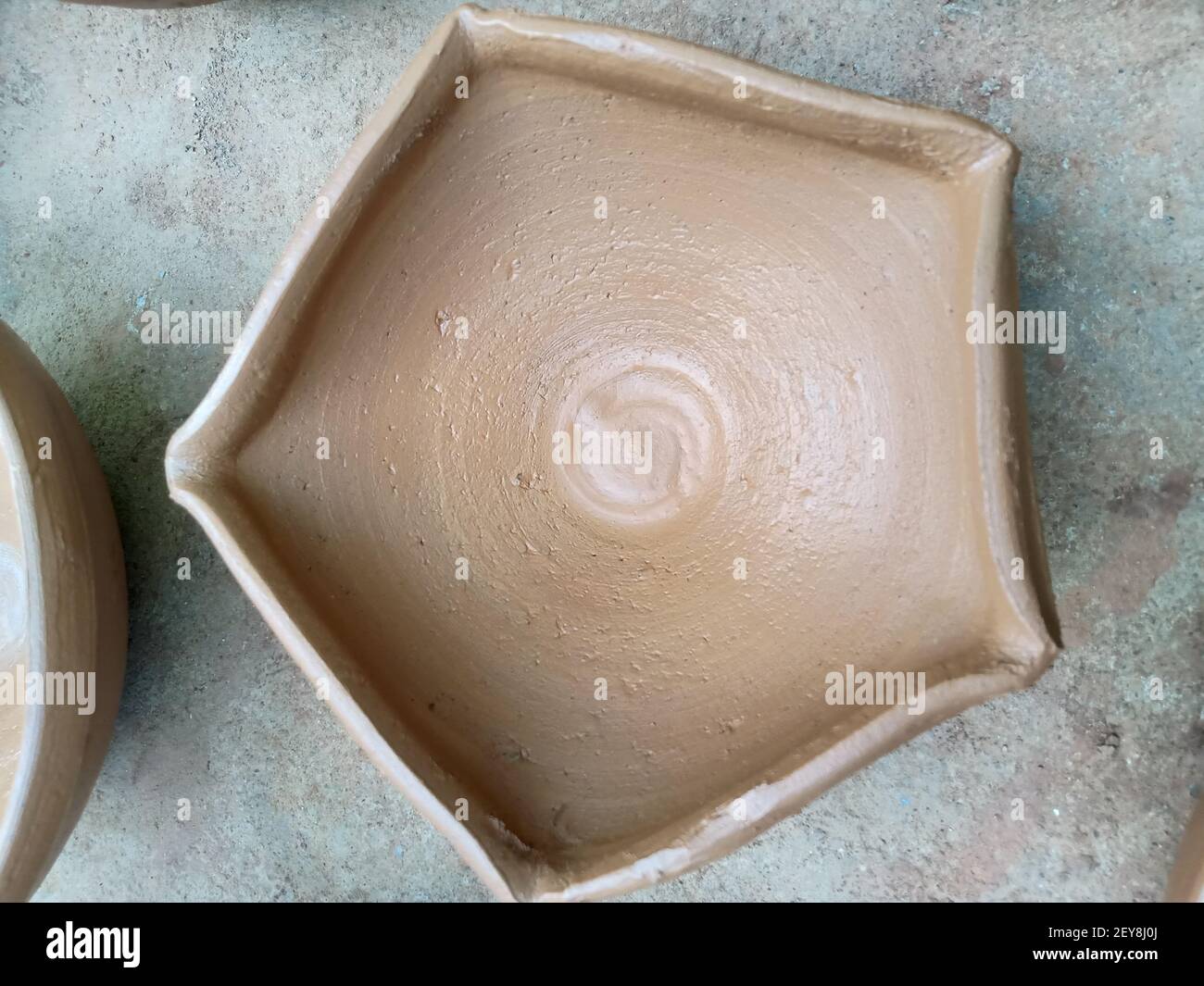 A top view of shallow pentagon-shaped clay pot Stock Photo - Alamy