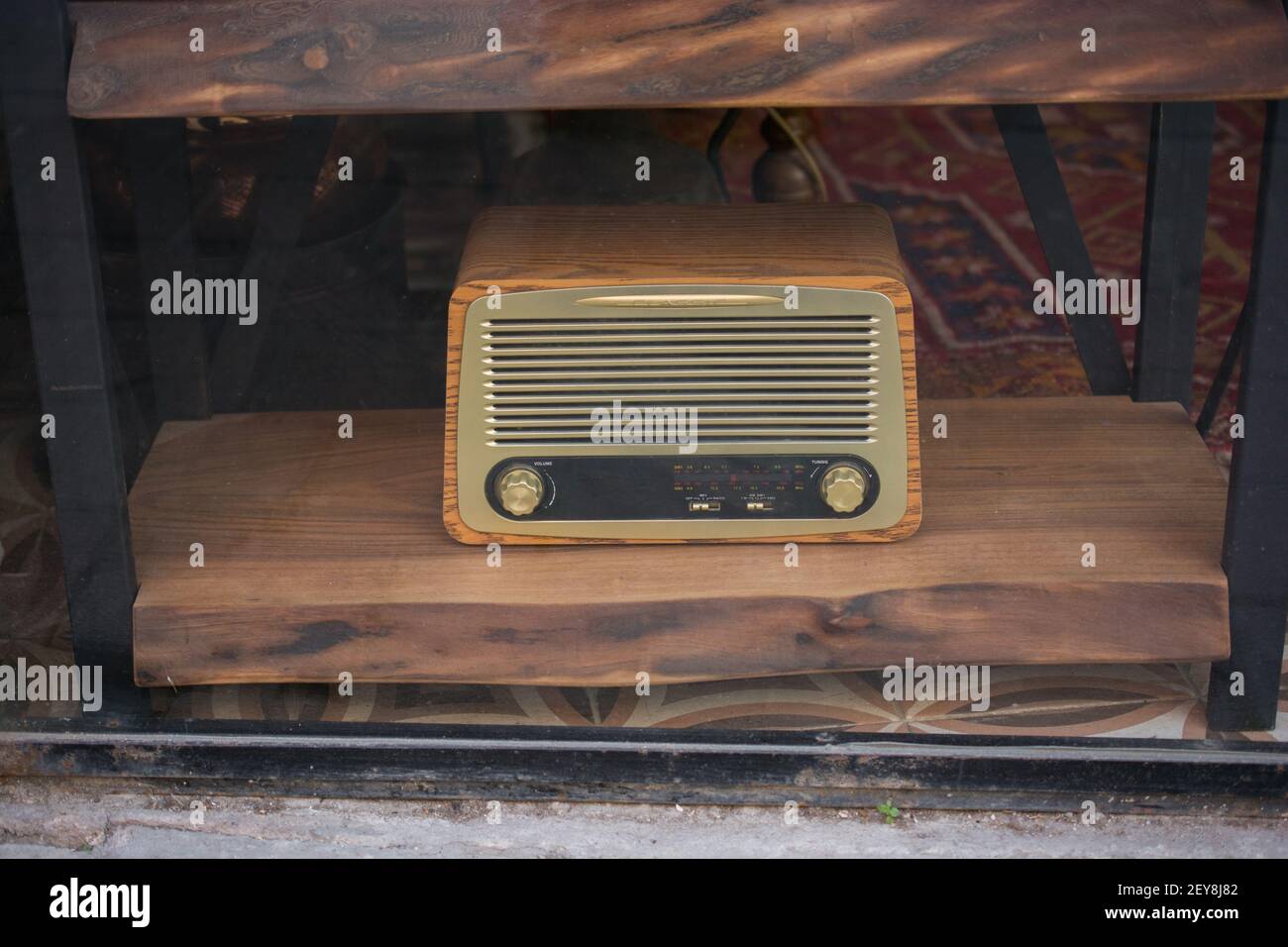 A vintage radio on a wooden shelf Stock Photo - Alamy