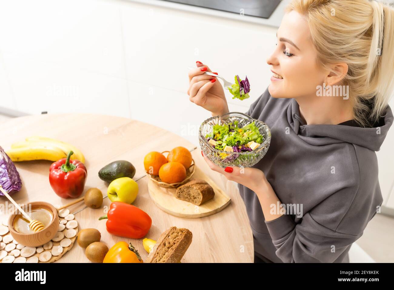 fresh fruits and vegetables on the table in kitchen interior, healthy ...