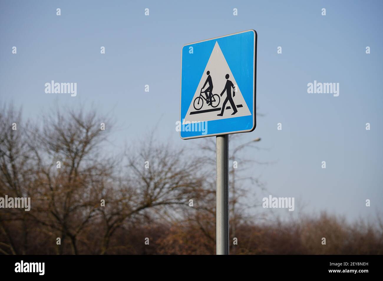 A blue street sign for bikers and pedestrians Stock Photo - Alamy