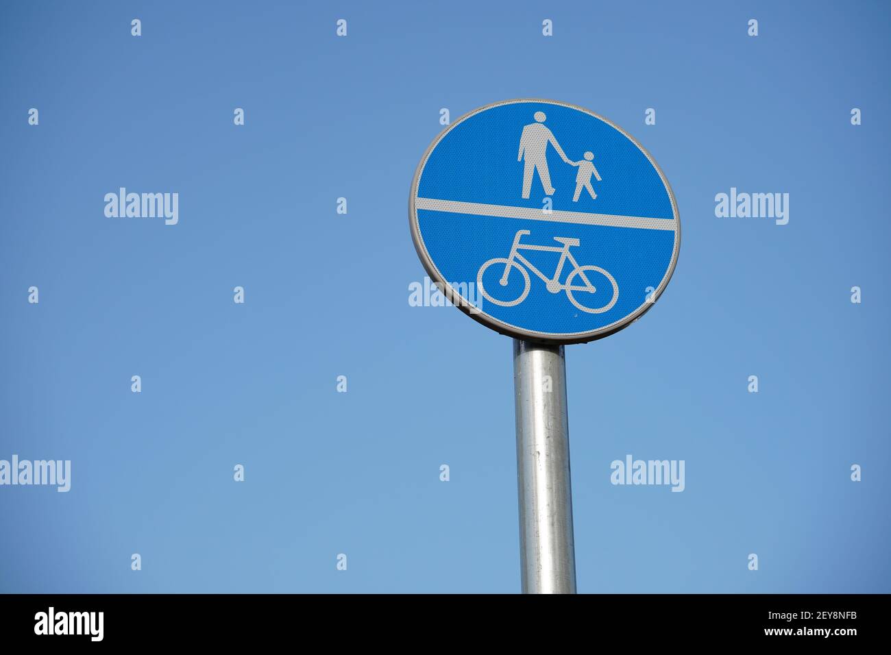 A blue street sign for bikers and pedestrians Stock Photo - Alamy