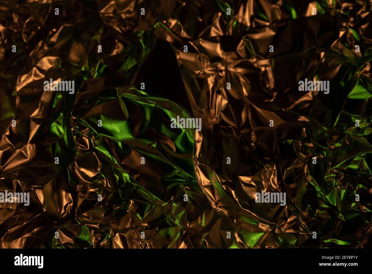 A crumpled colorful metal foil texture background Stock Photo - Alamy