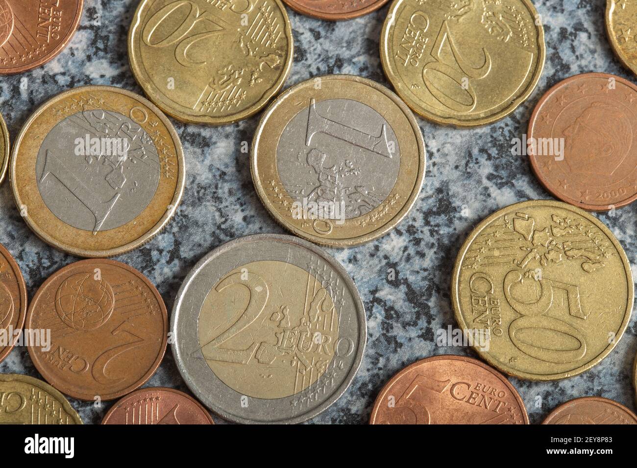 A high angle shot of different euro coins on a table Stock Photo - Alamy