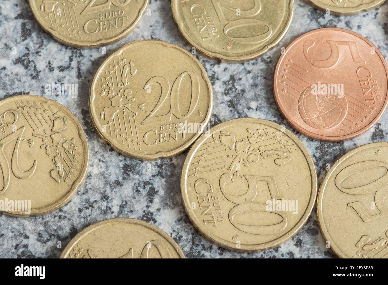 A high angle shot of different euro coins on a table Stock Photo - Alamy