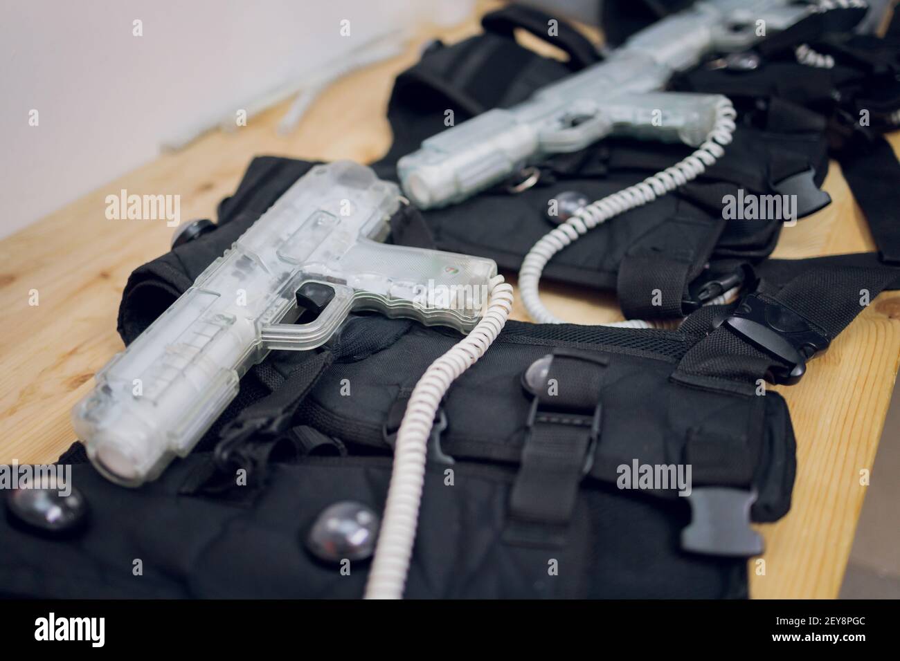 Weapons close-up on a military man standing inside the building and ...