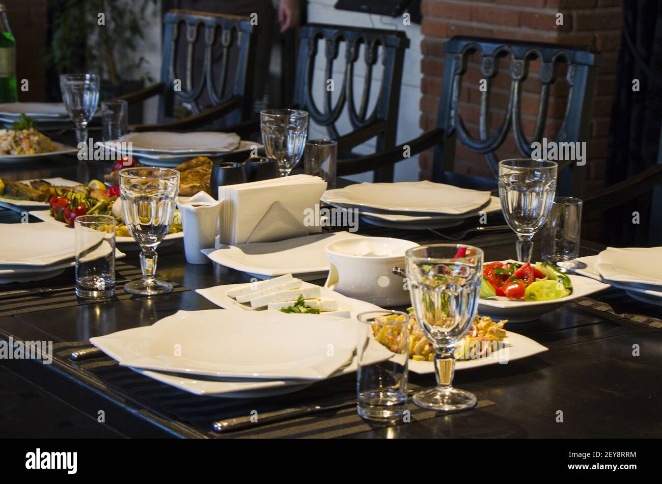 A closeup shot of an arranged dinner table with food Stock Photo - Alamy