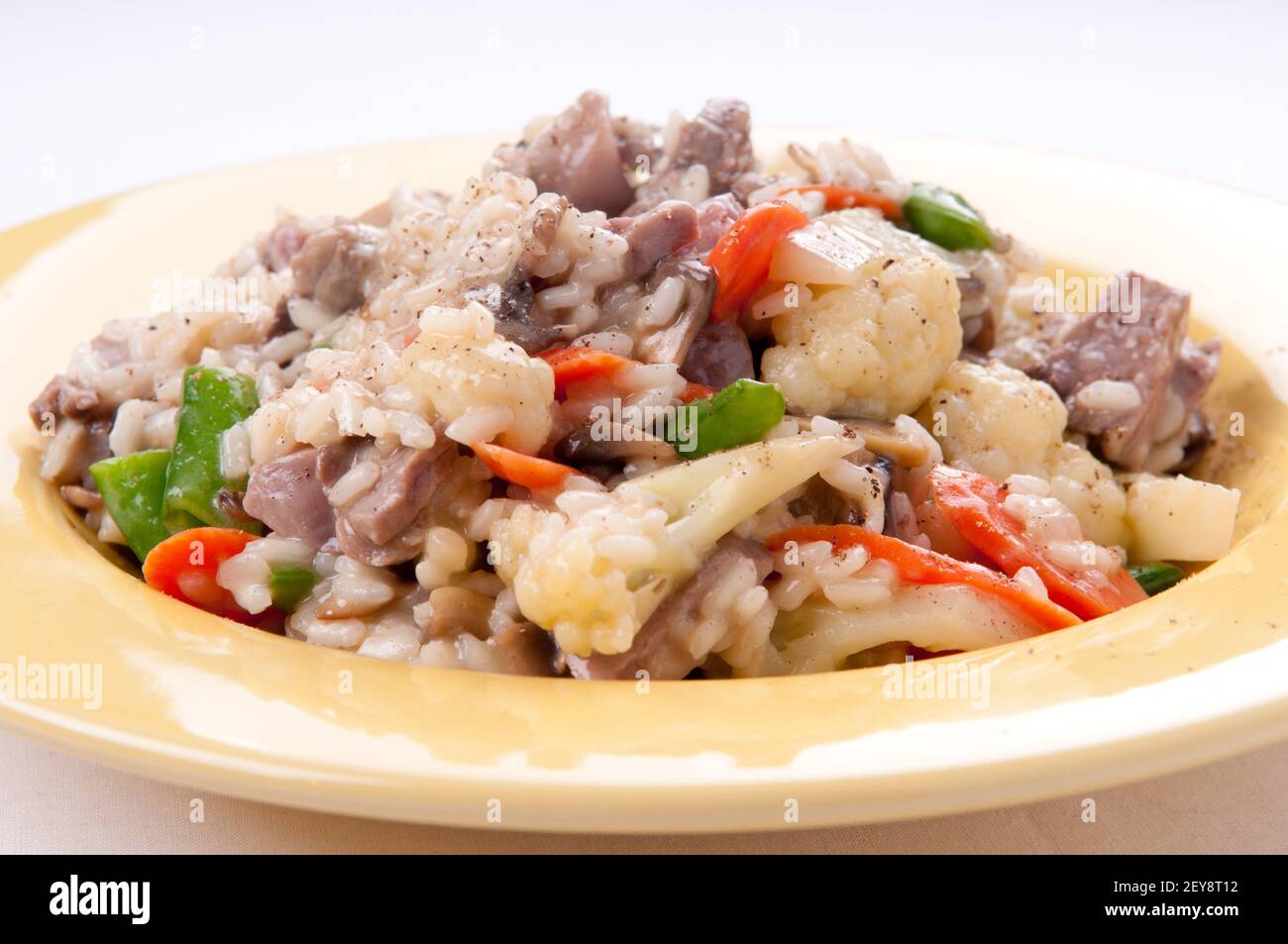 creamy lamb risotto with fresh seasonal vegetables Stock Photo - Alamy