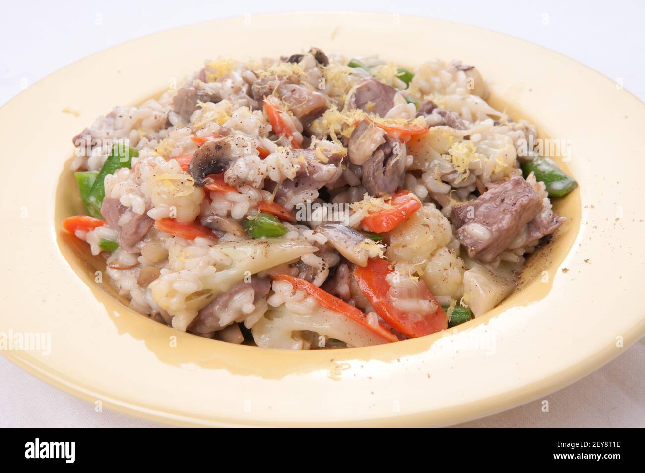 creamy lamb risotto with fresh seasonal vegetables Stock Photo - Alamy