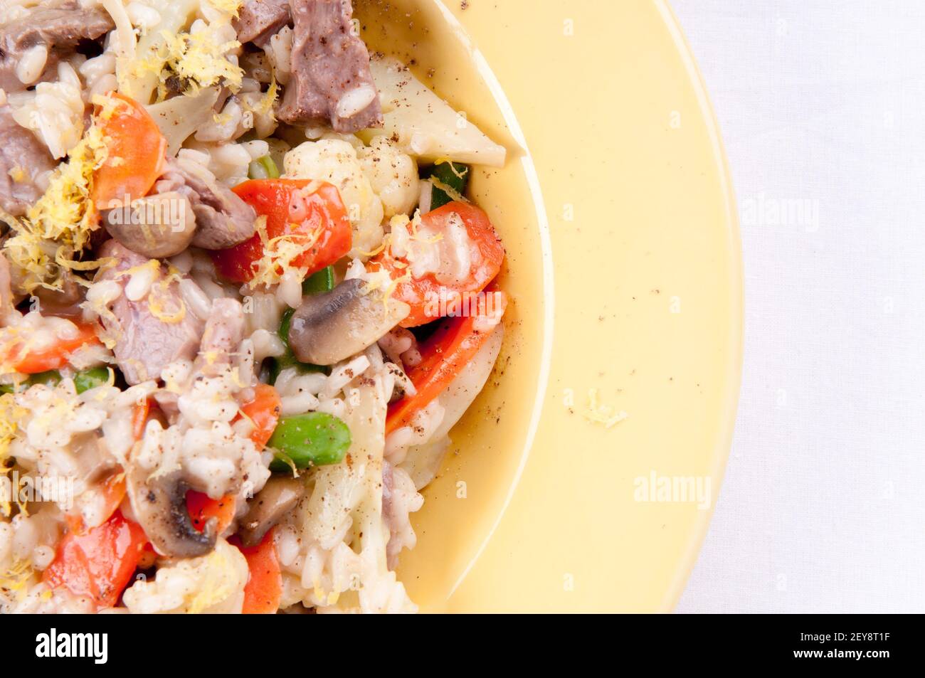 creamy lamb risotto with fresh seasonal vegetables Stock Photo - Alamy
