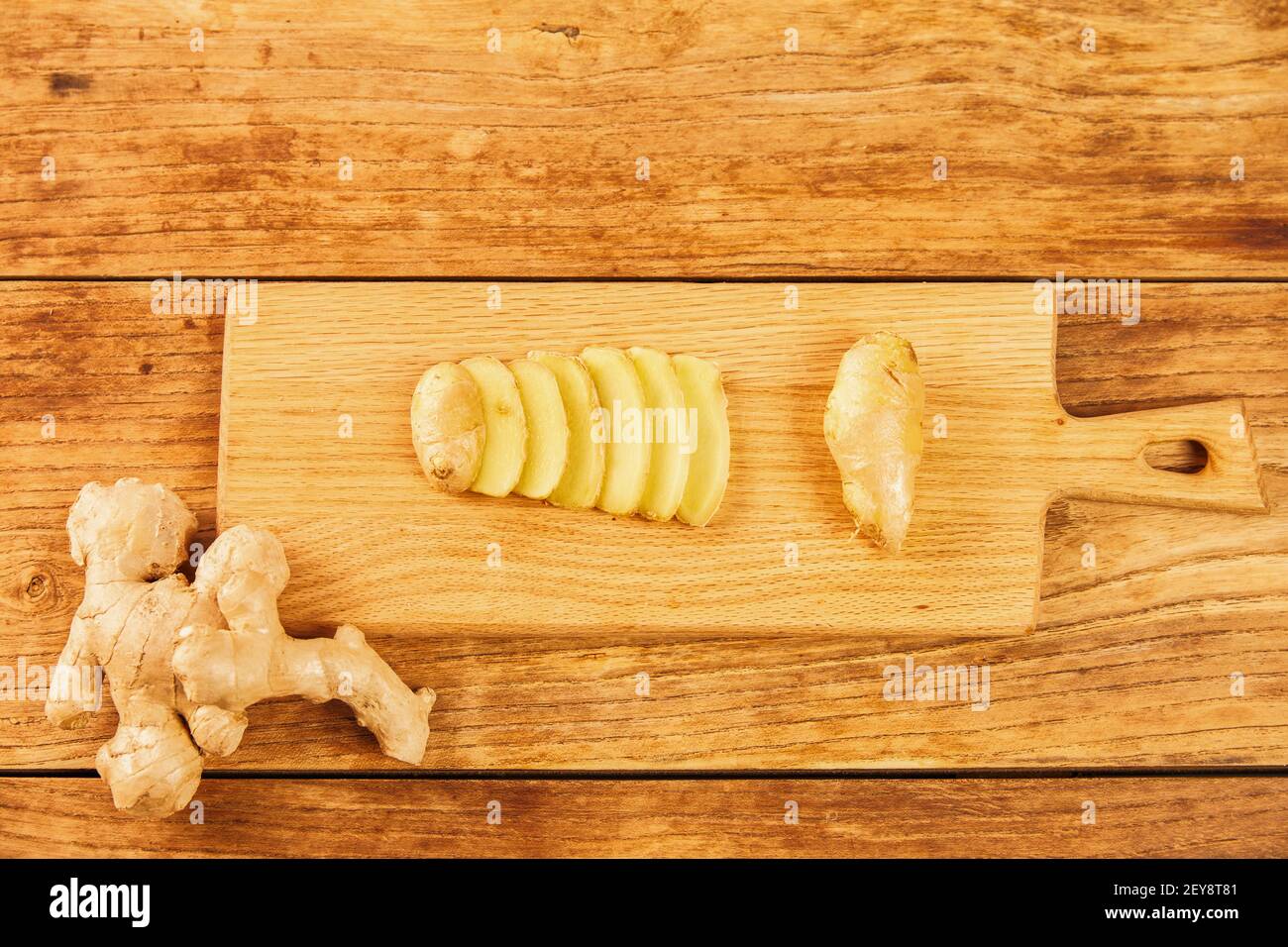 A top view of sliced ginger on a chopping board Stock Photo - Alamy