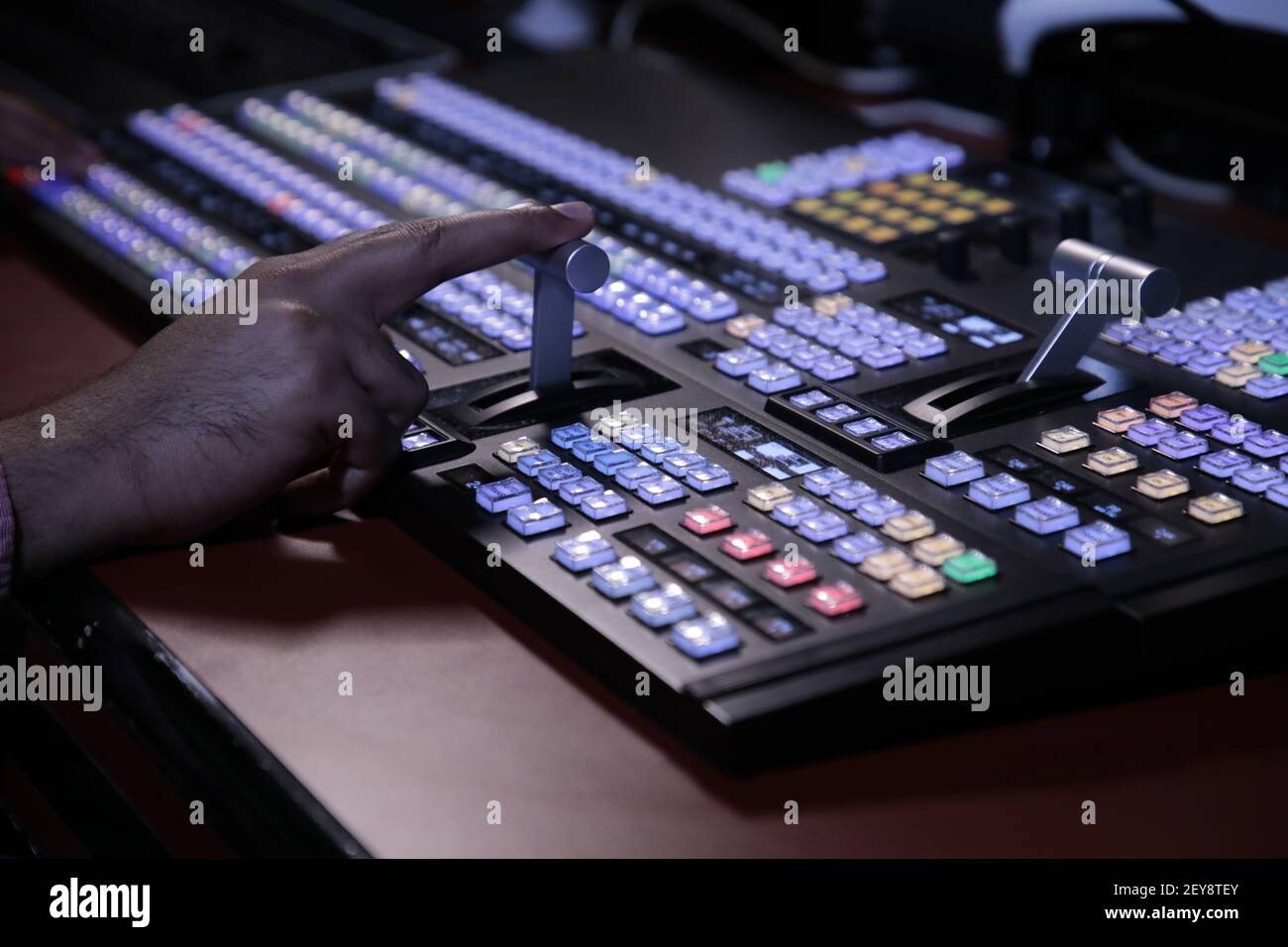 Hands on dissolve of Switcher buttons in studio TV station, Audio and ...