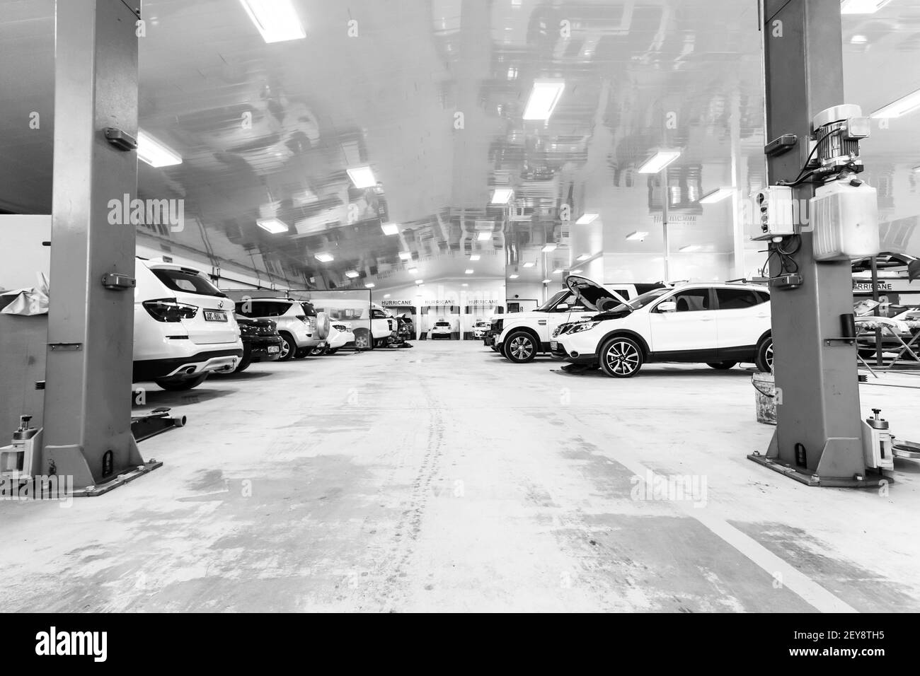 Mechanic inside modern car Black and White Stock Photos & Images - Alamy