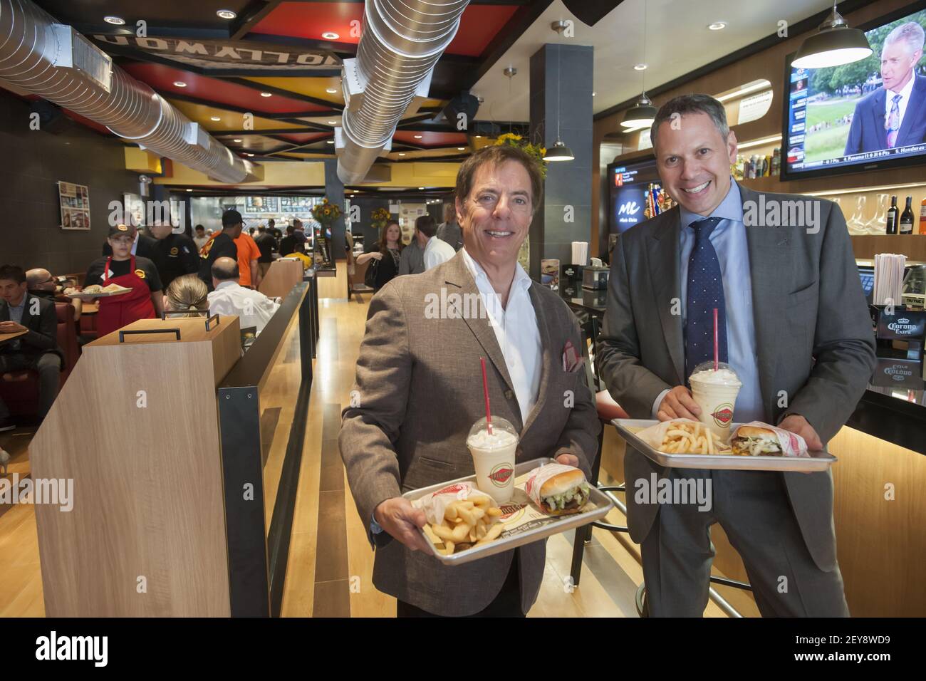 Reise Organization Chairman and CEO Dennis Riese, left, and Fatburger ...