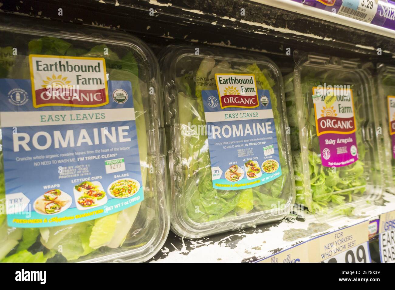Earthbound Farm Organic cleaned and packaged romaine lettuce are seen ...