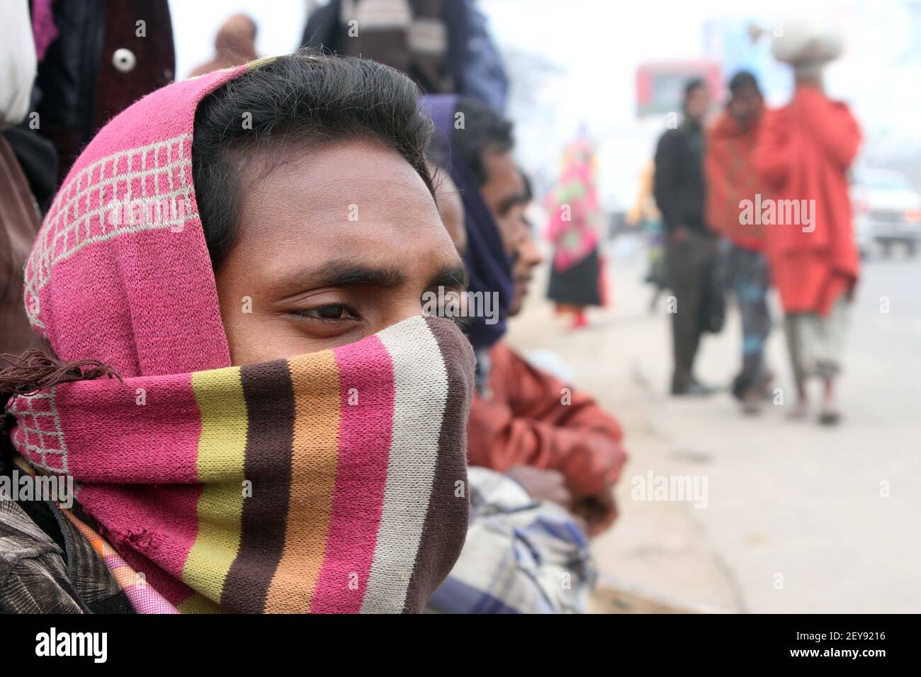 9 January 2013 - Dhaka, Bangladesh - Bangladeshi poor man cuddle beside ...