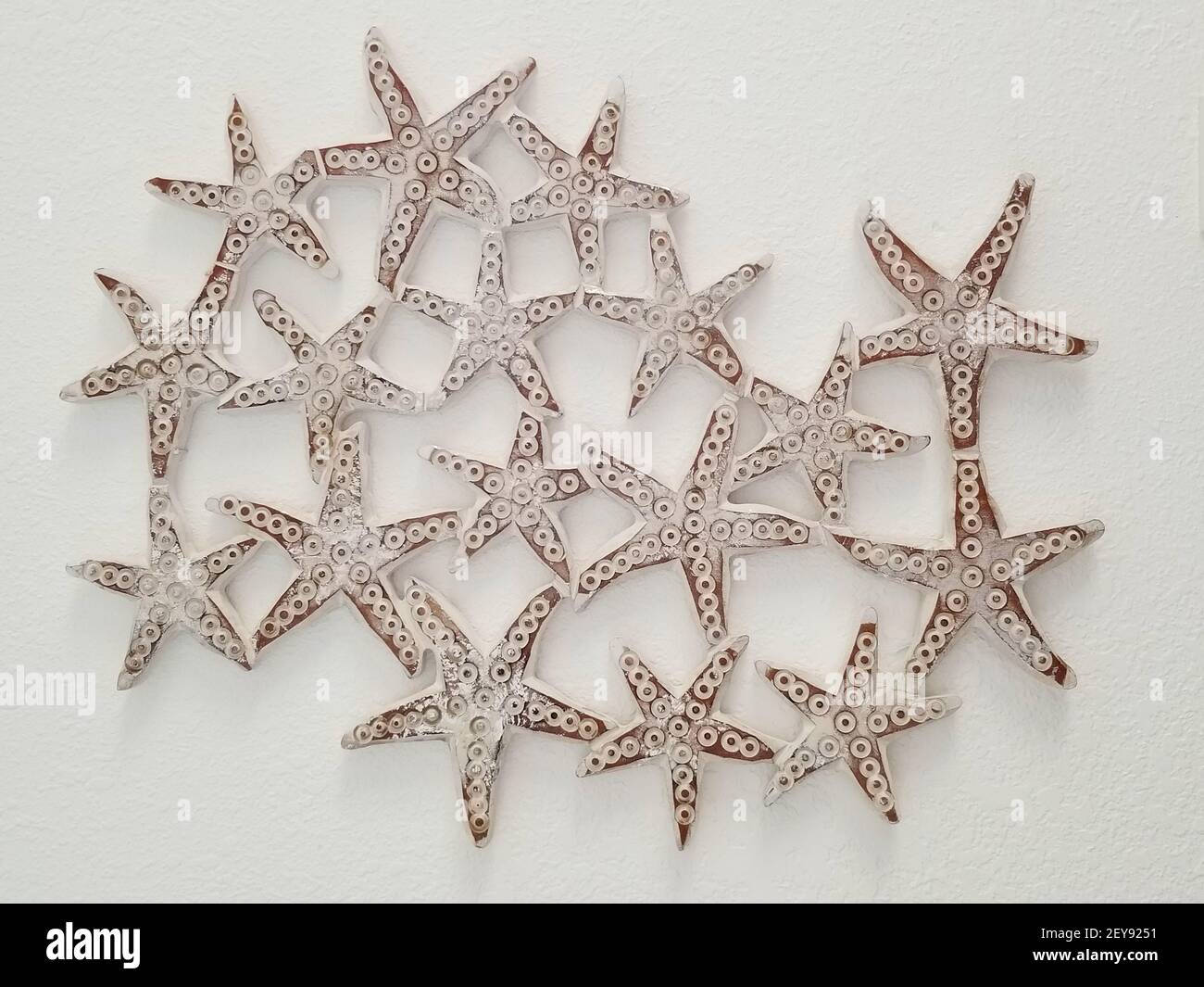 Starfish decoration on the wall inside a beach living room Stock Photo ...