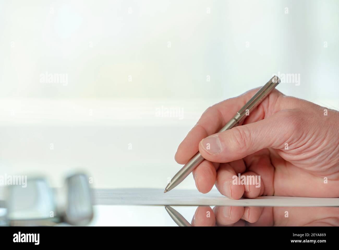 Man signing document Stock Photo - Alamy