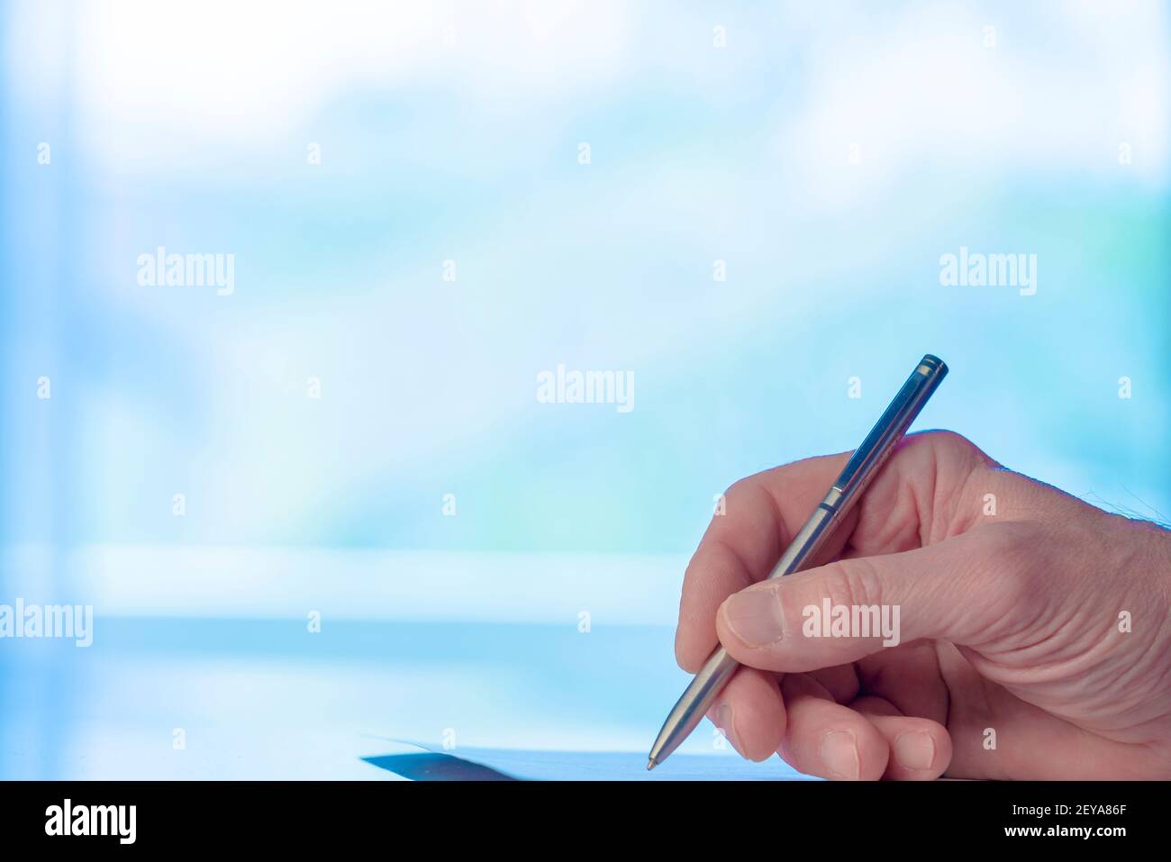 Man signing document Stock Photo - Alamy