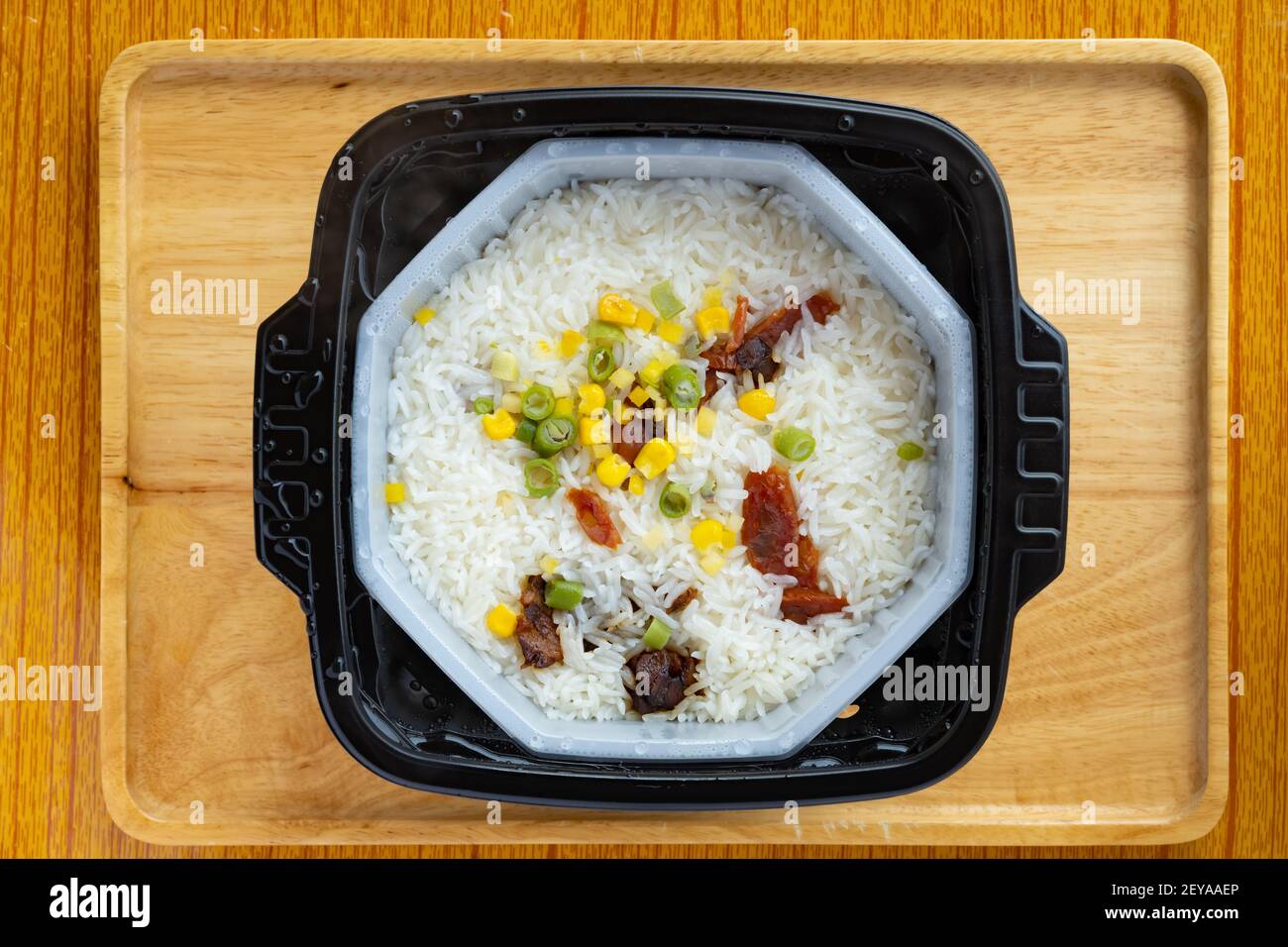 fresh self cooking fast food of rice with Chinese style sausage and ...