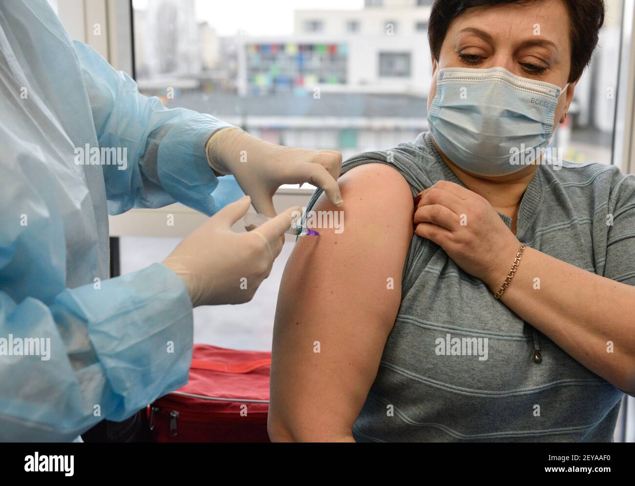 A medical worker receives an injection with the AstraZeneca (Covishield ...