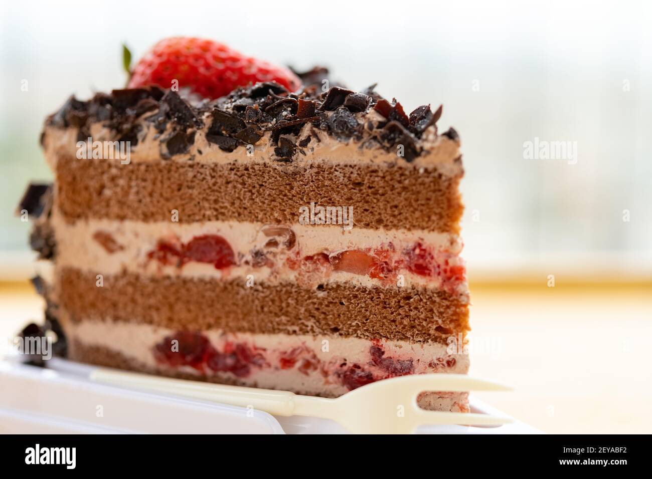 side view chocolate flavor cake with strawberry close up horizontal ...