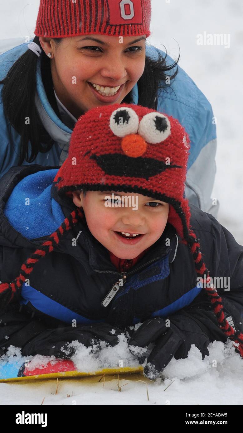 Wendy Oberer, from Cockeysville, sleds down a slushy hill at Greenwood ...