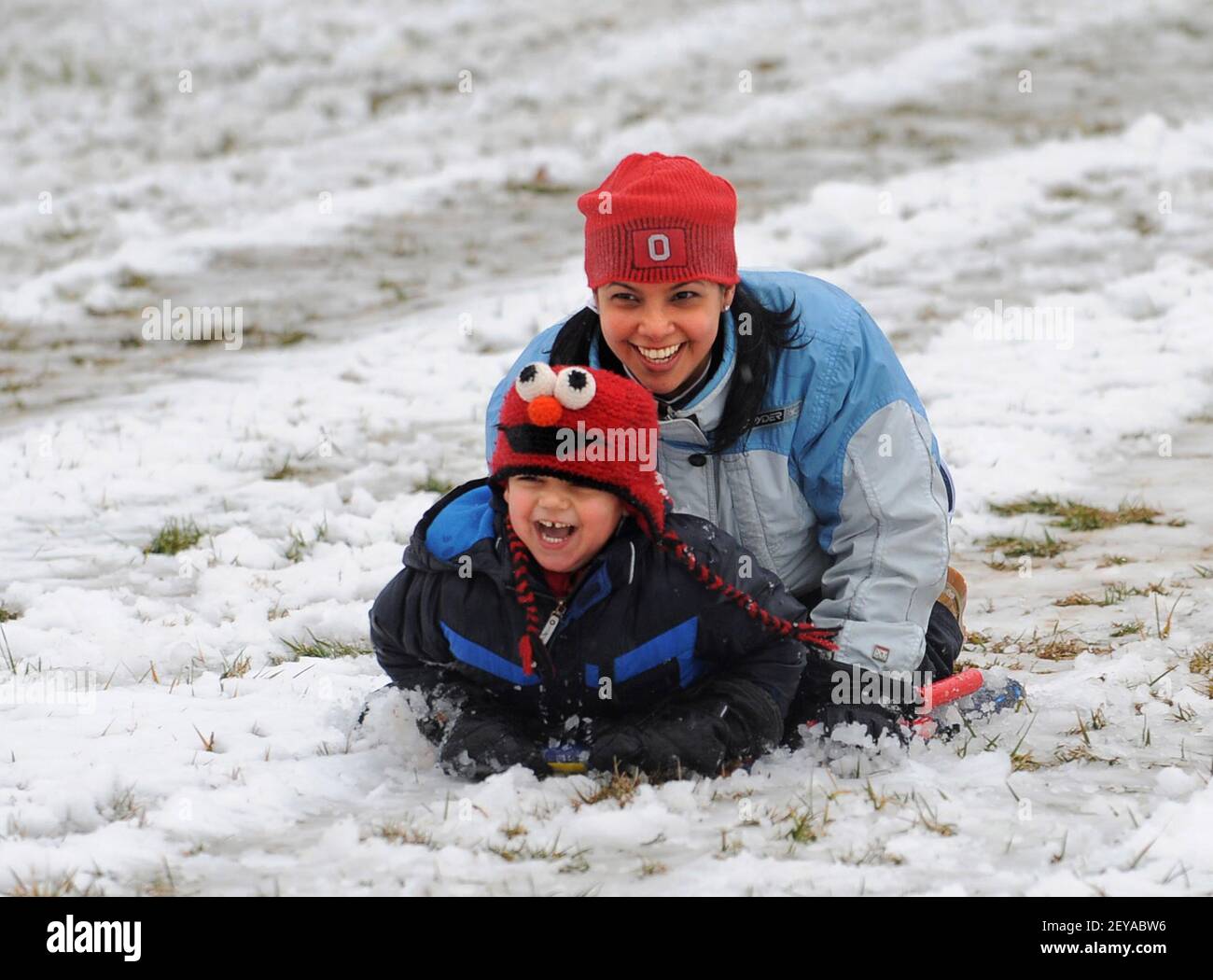 Wendy Oberer, from Cockeysville, sleds down a slushy hill at Greenwood ...