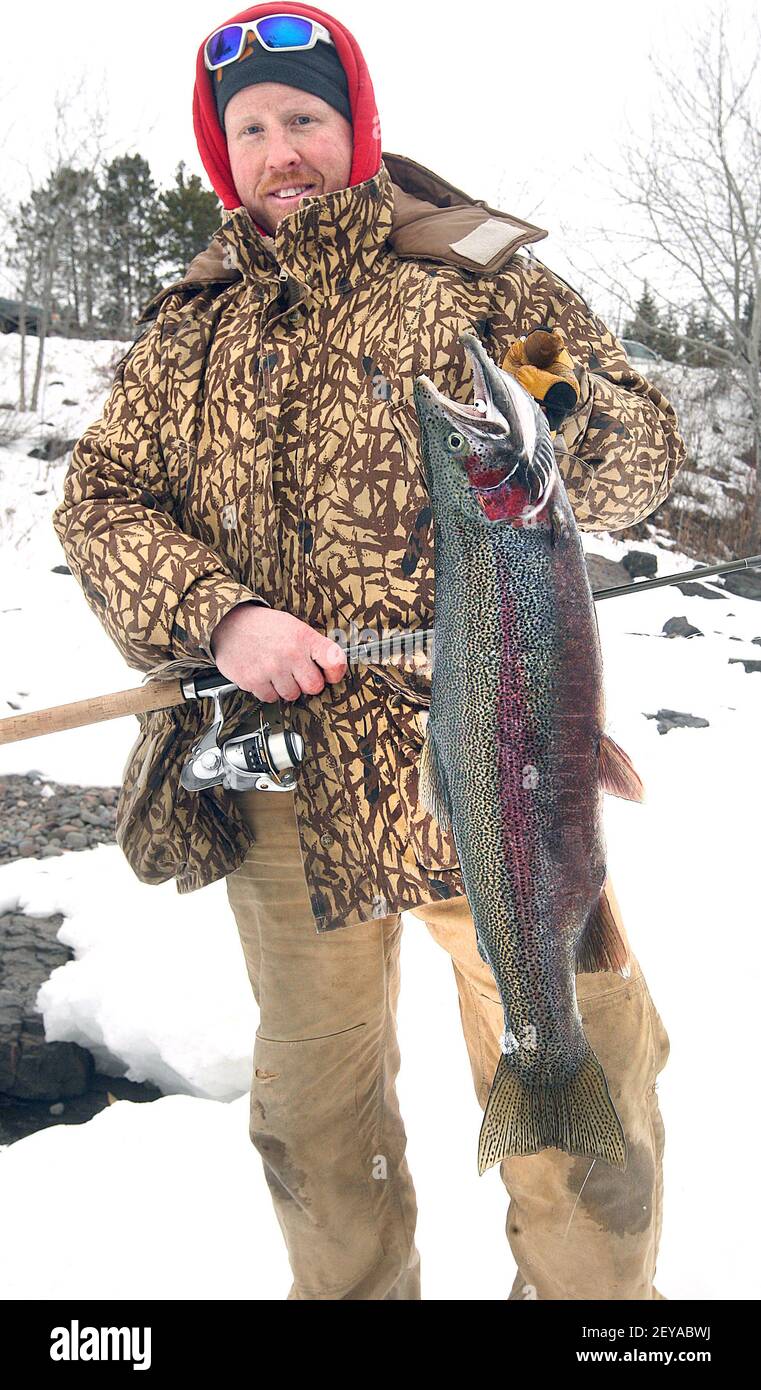 Bryan Dunaiski of Esko holds a hefty Kamloops rainbow trout he caught ...