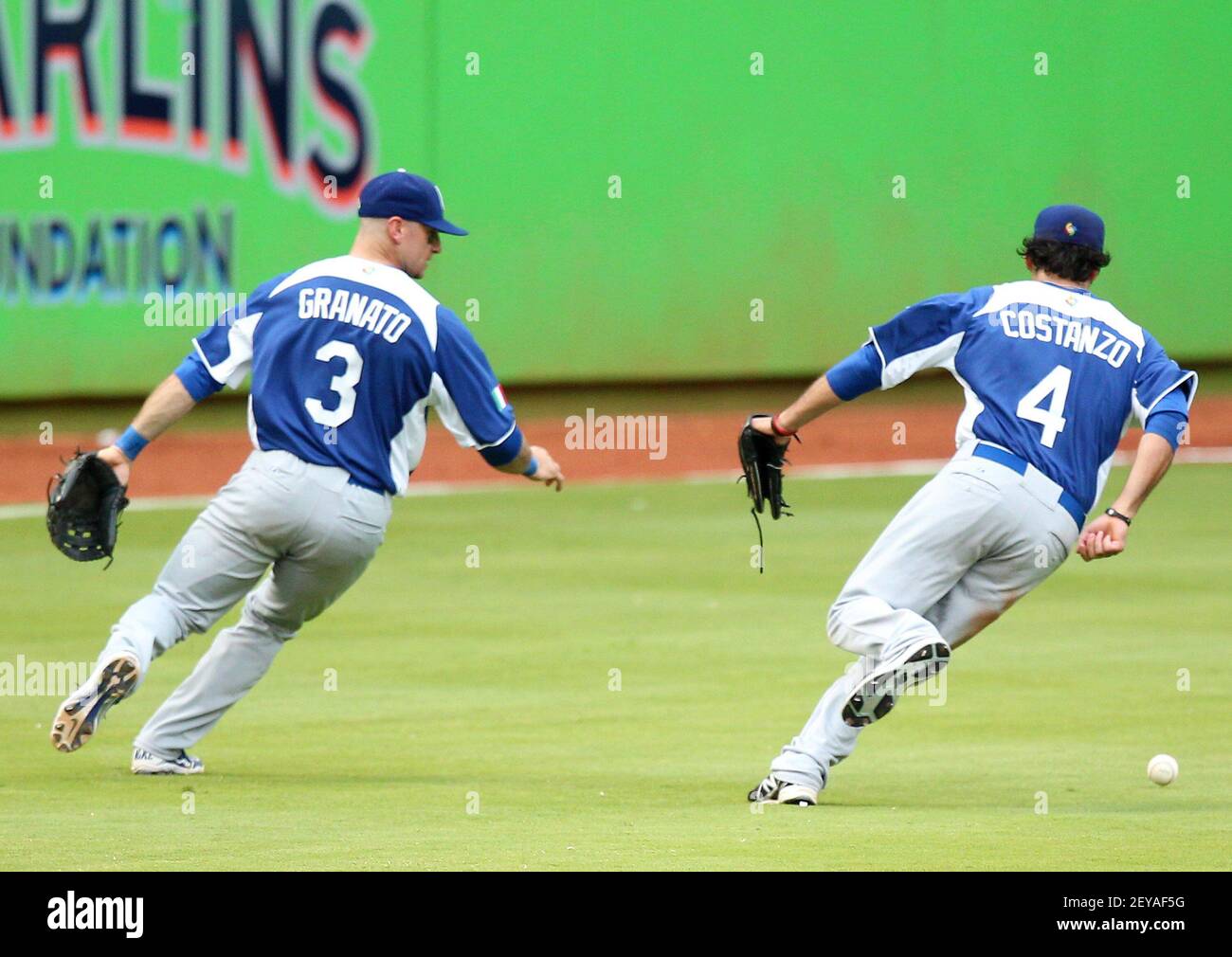 Italy shortstop Anthony Granato (3) and left fielder Mike Costanzo are ...