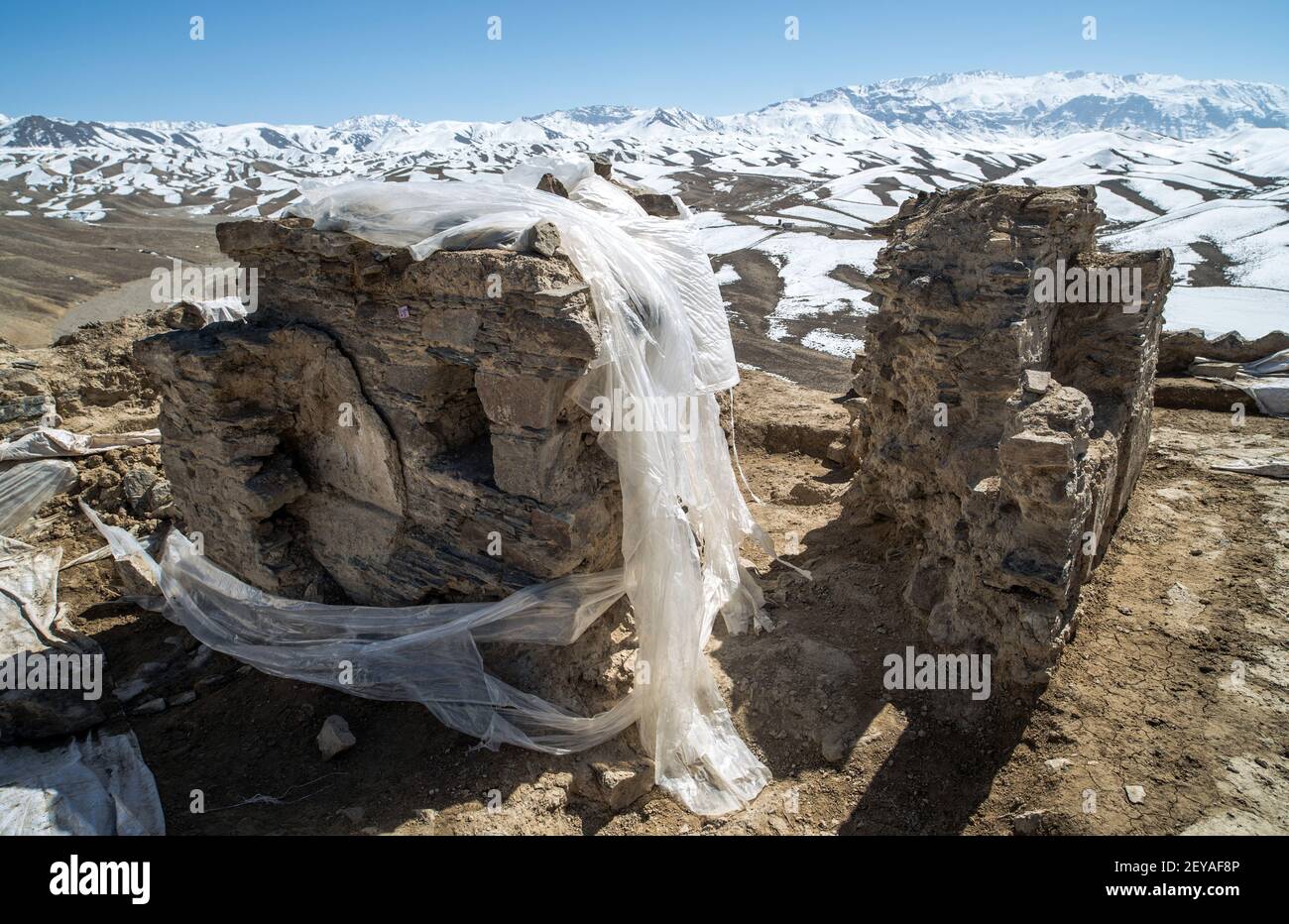 A stupa and other structures are seen at a mountaintop Buddhist ...