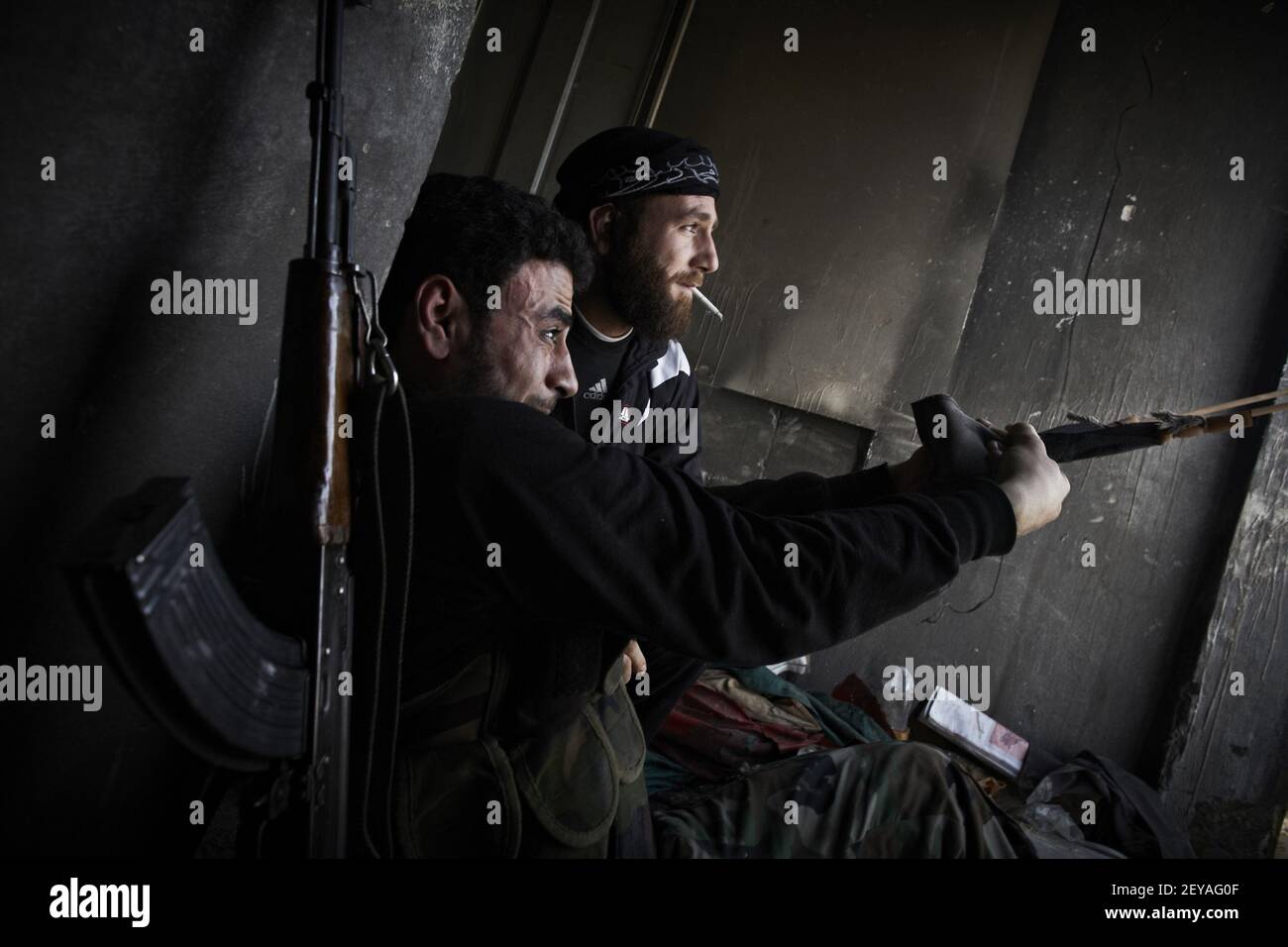 Along the front line of Bustan Al Kaser, FSA fighters use a homemade ...