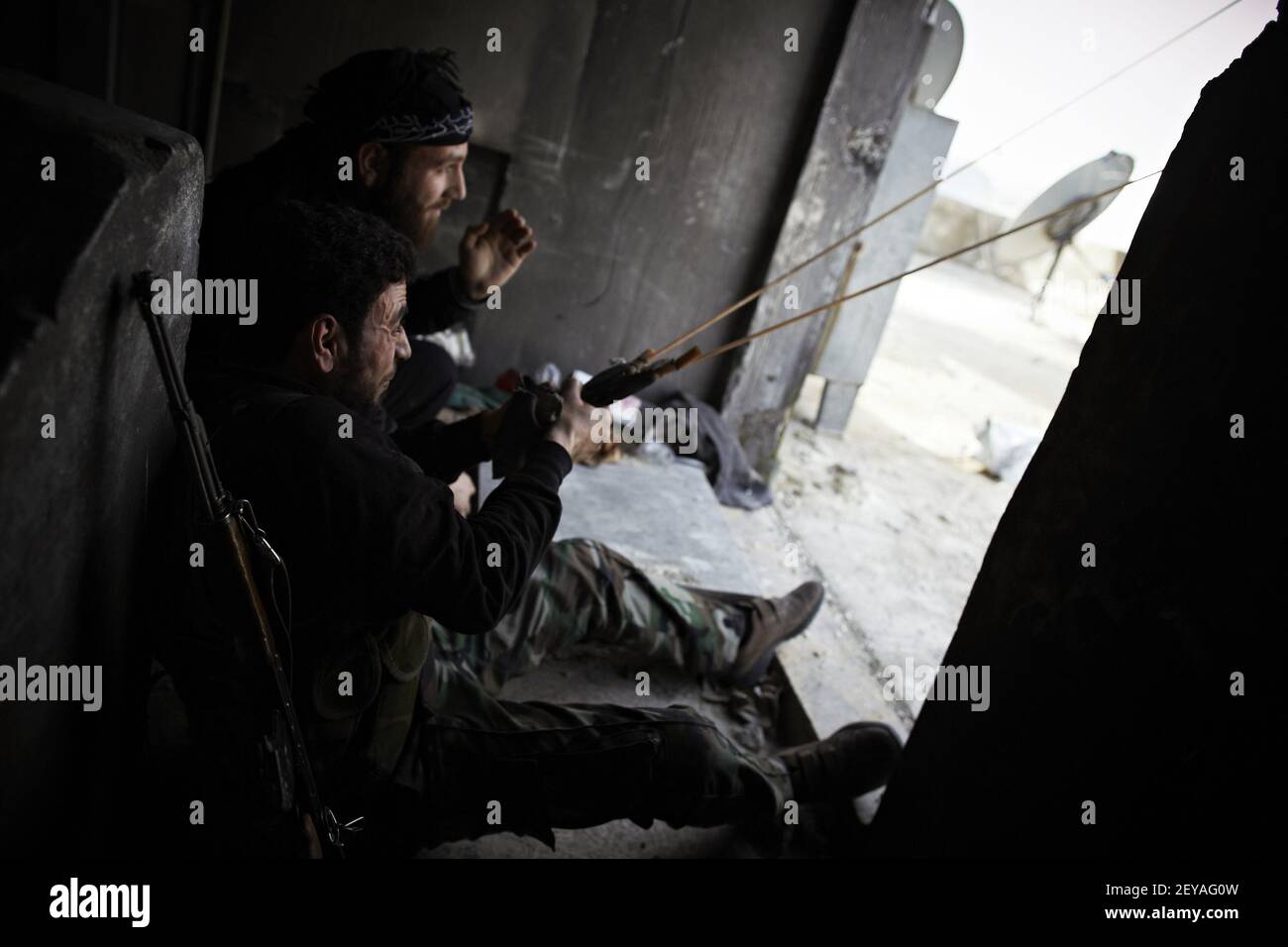 Along the front line of Bustan Al Kaser, FSA fighters use a homemade ...