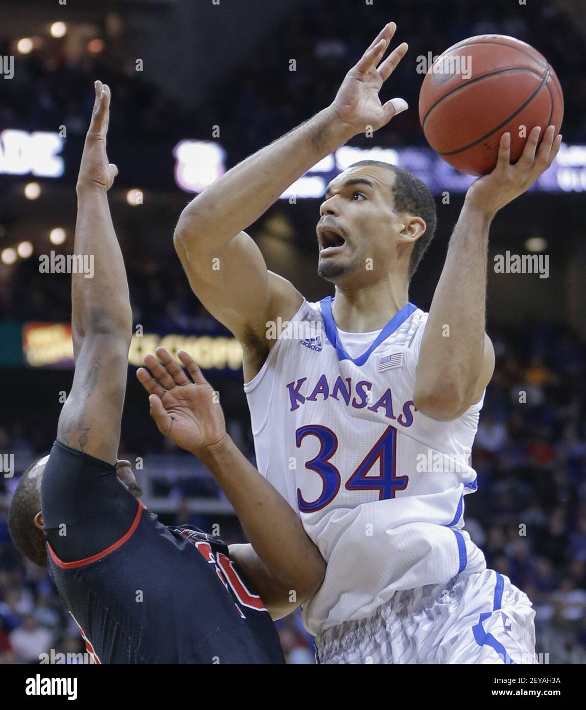 Kansas' Perry Ellis shoots over Texas Tech's Toddrick Gothcer during ...
