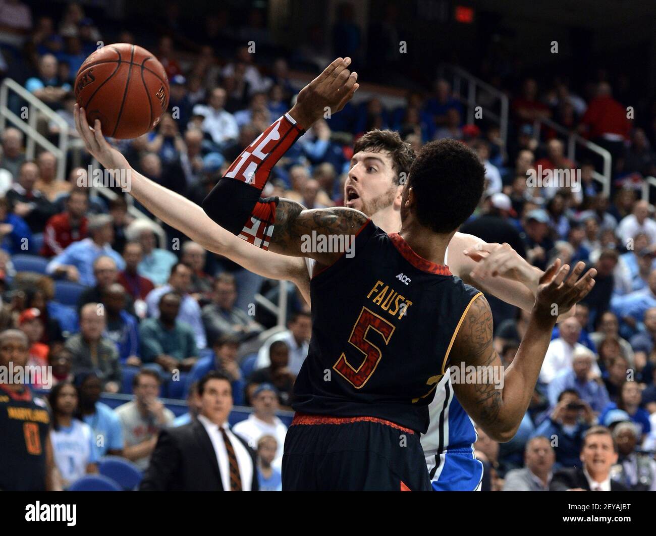 Duke forward Ryan Kelly (34) tries to hold onto the ball as Maryland ...
