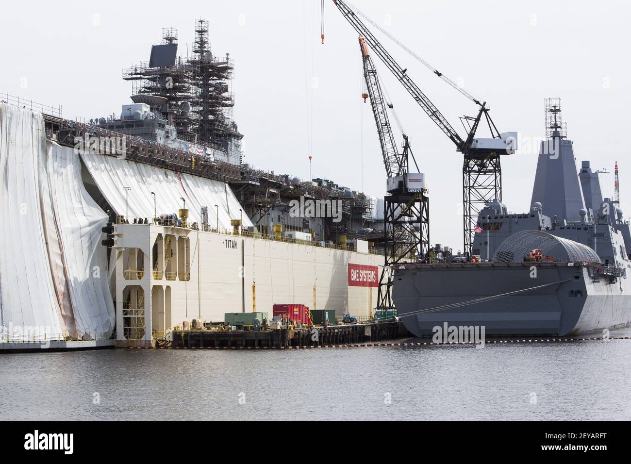 An amphibious assault ship, left, and a amphibious transport dock, also ...