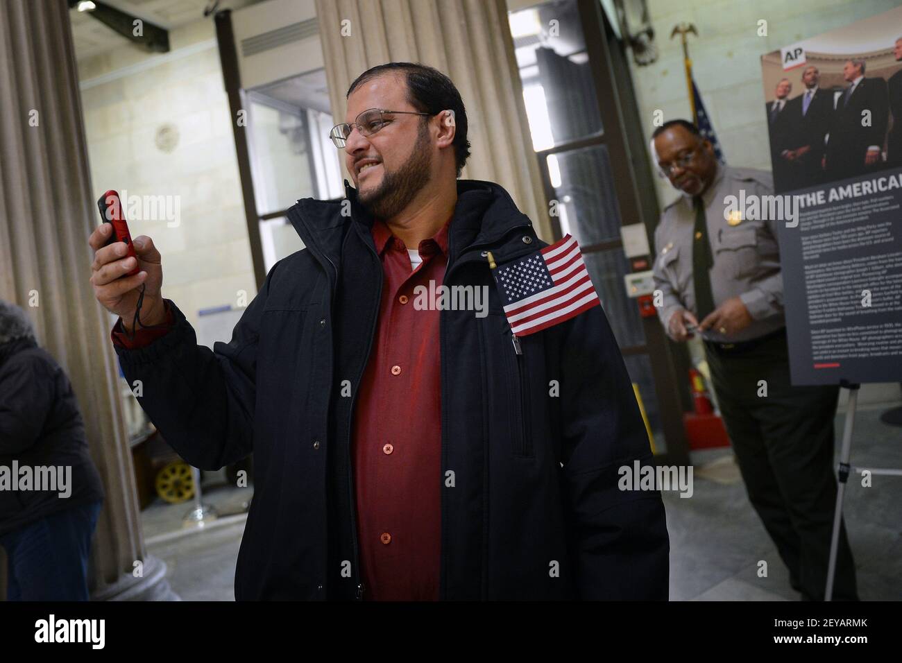 Ashraf Ibrahim proudly tapes the ceremony where his wife Fatma Atia ...