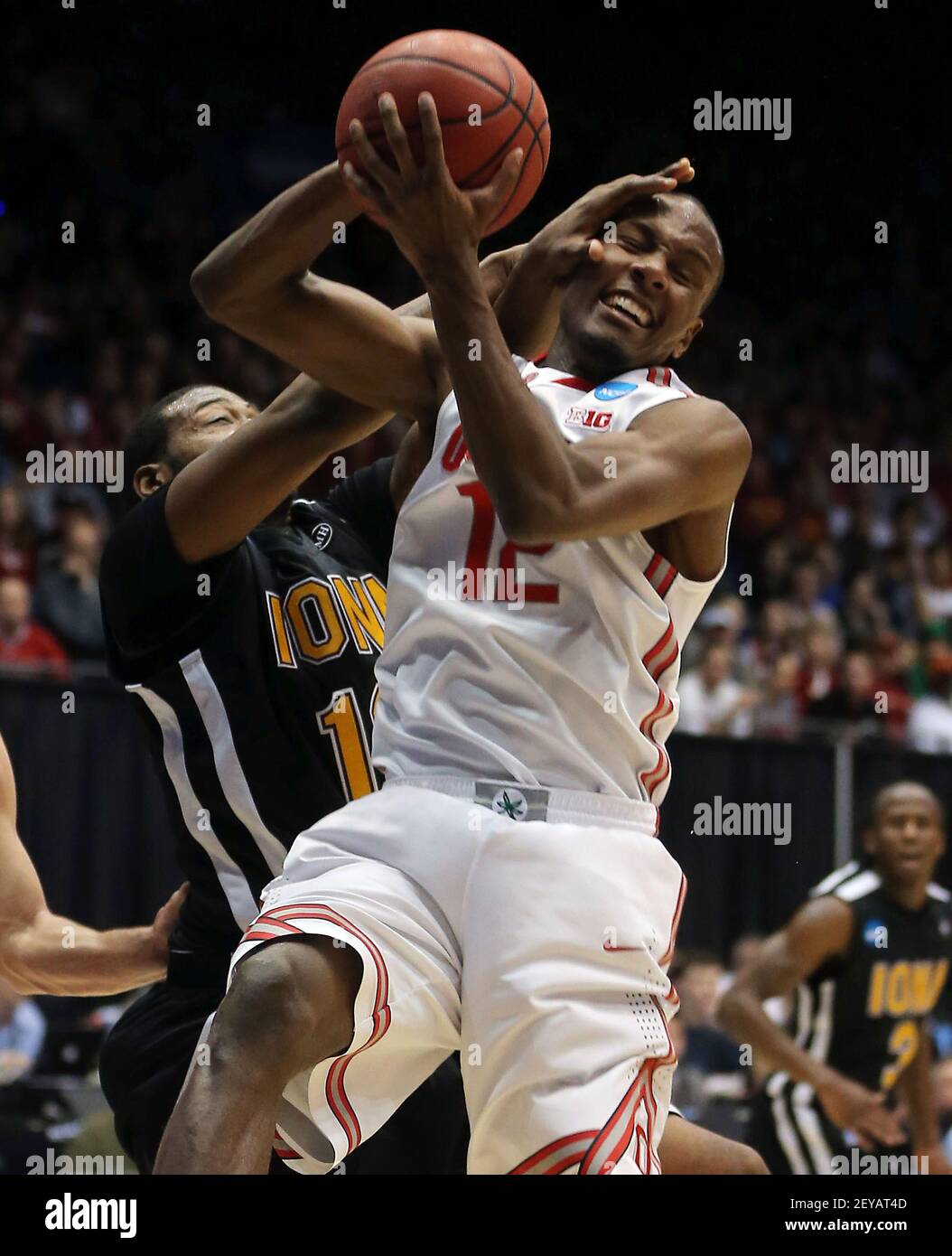 Ohio State's Sam Thompson (12) rebounds under pressure from Iona's ...